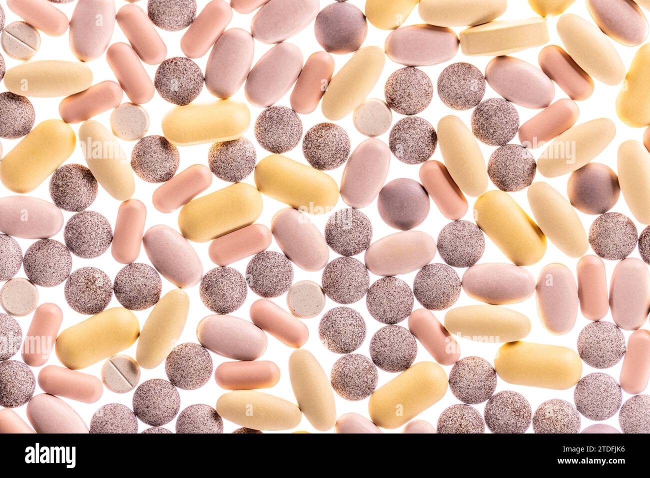 Pastel coloured pills and tablets background Stock Photo - Alamy