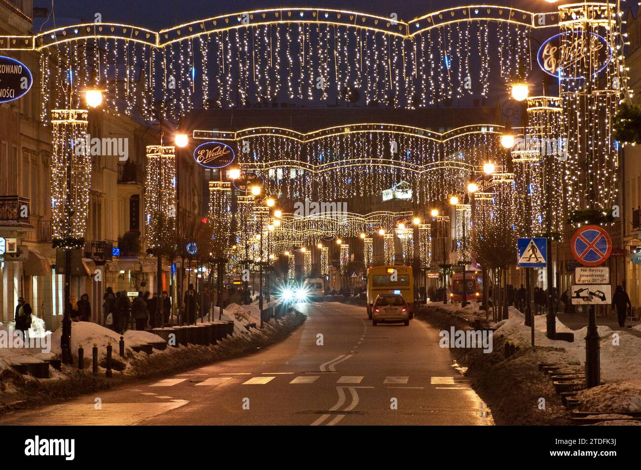 Garlands of Christmas lights, evening at Nowy Swiat street in Warsaw ...