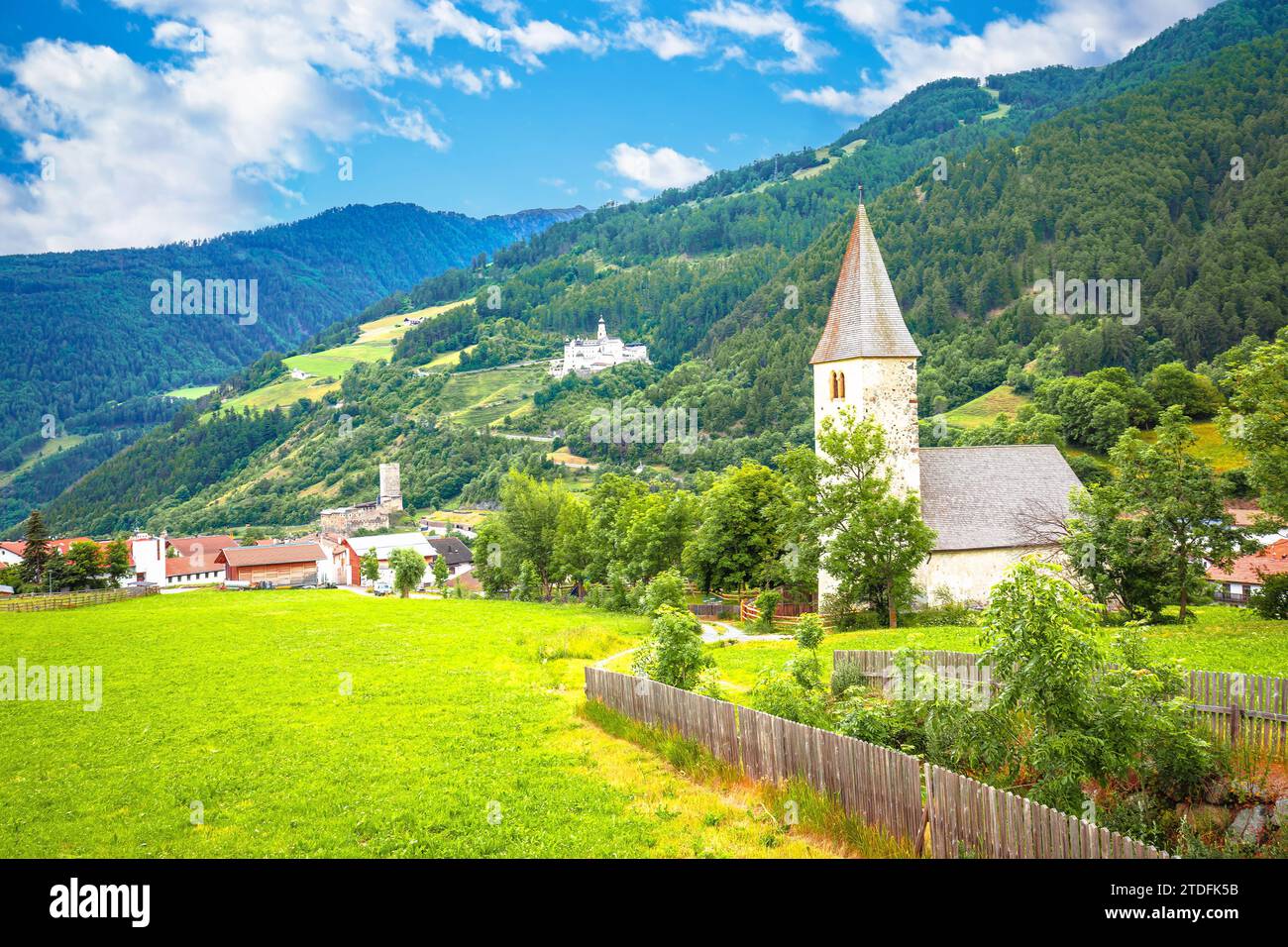 Idyllic alpine village of Burgeis and Abbey of Monte Maria view ...