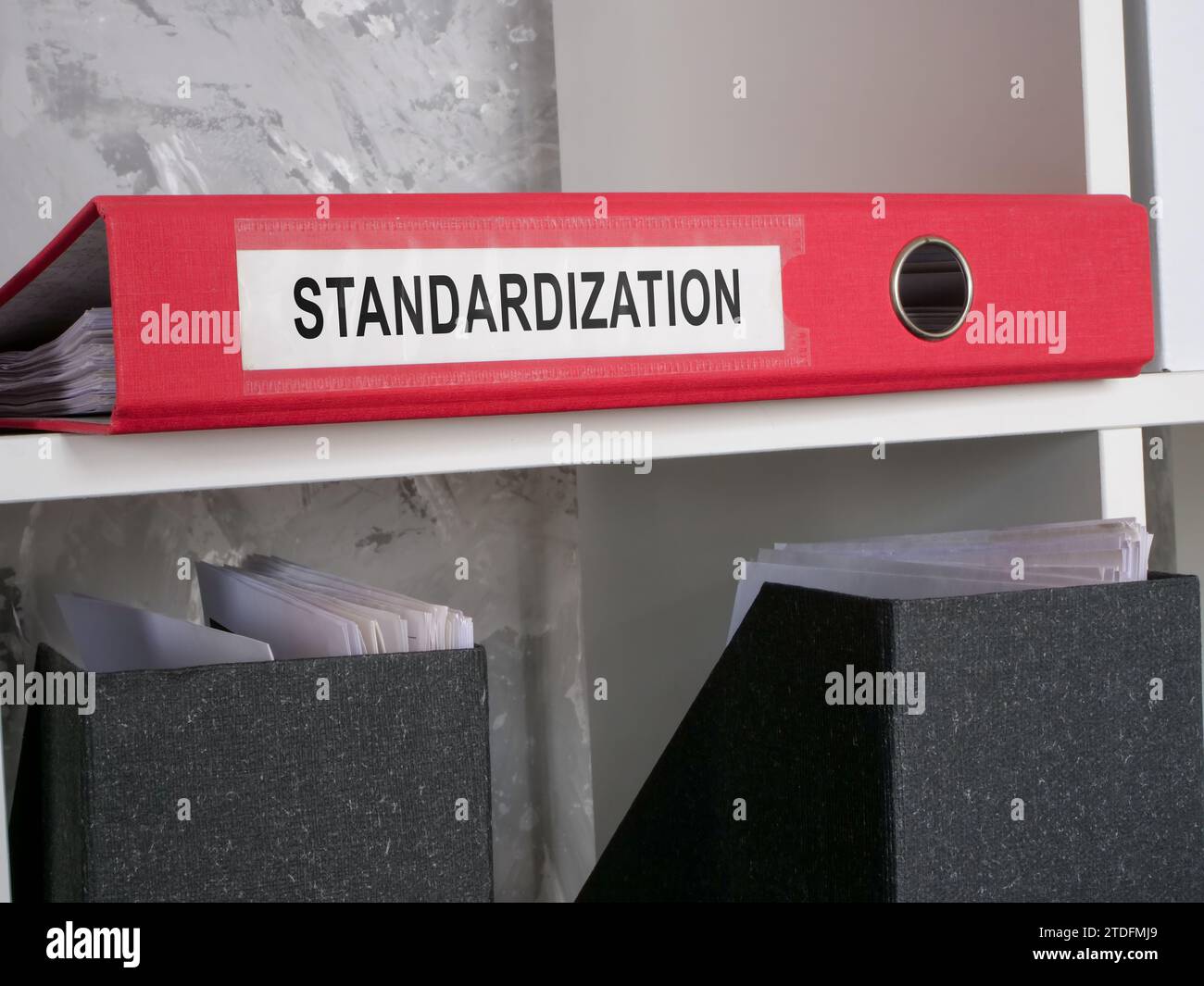 A folder with documents about standardization on a shelf Stock Photo ...