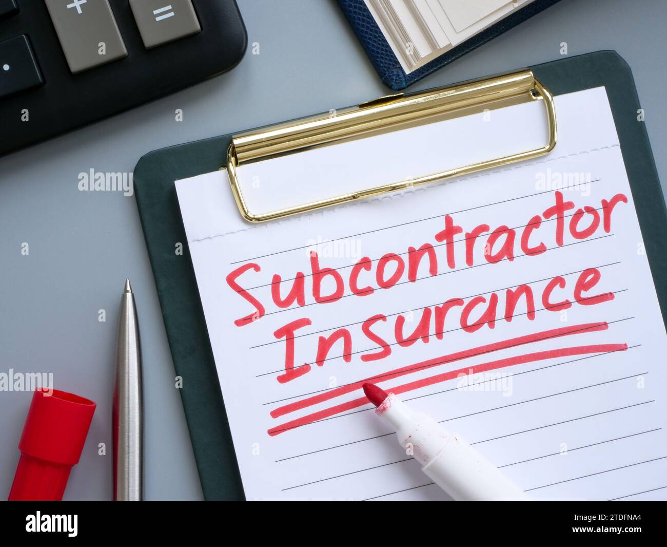 Subcontractor insurance written on a clipboard Stock Photo - Alamy