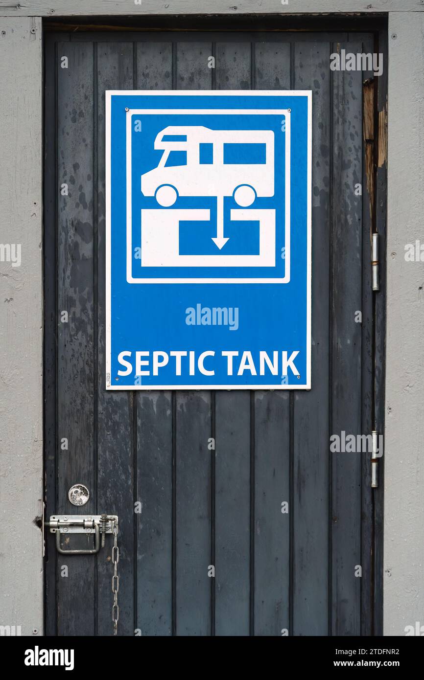 Sign of septic tank for emptying a caravan toilet on a wooden door ...