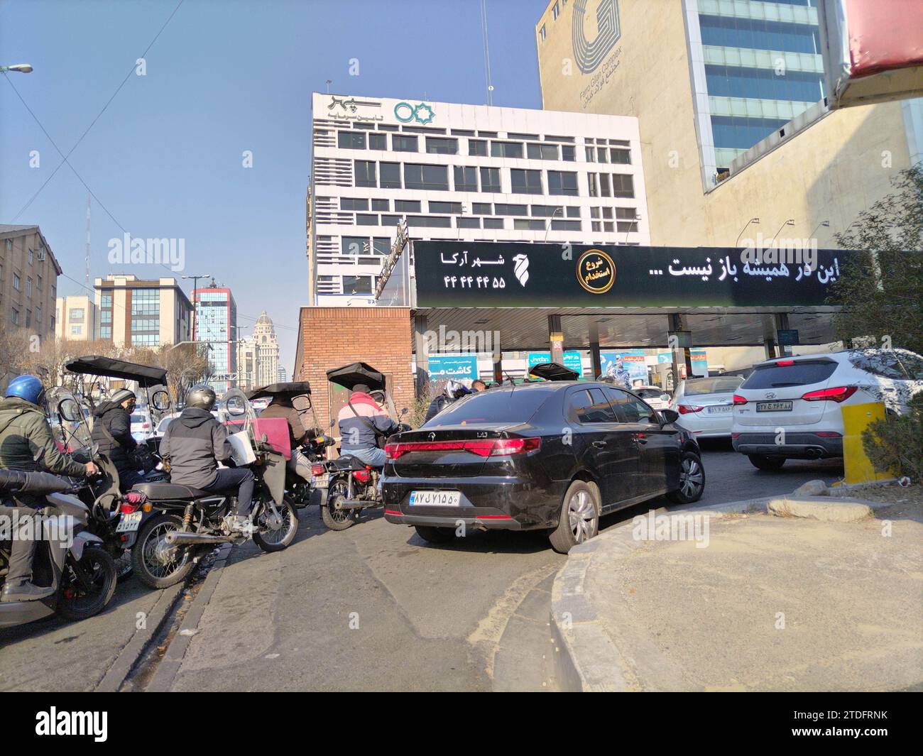 Tehran, Iran. 18th Dec, 2023. Vehicles line up at a gas station in ...