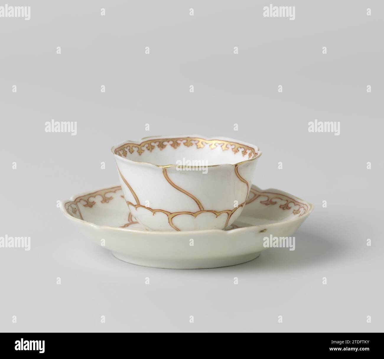 Cup and saucer with stylized flower and ornamental border, anonymous, c ...