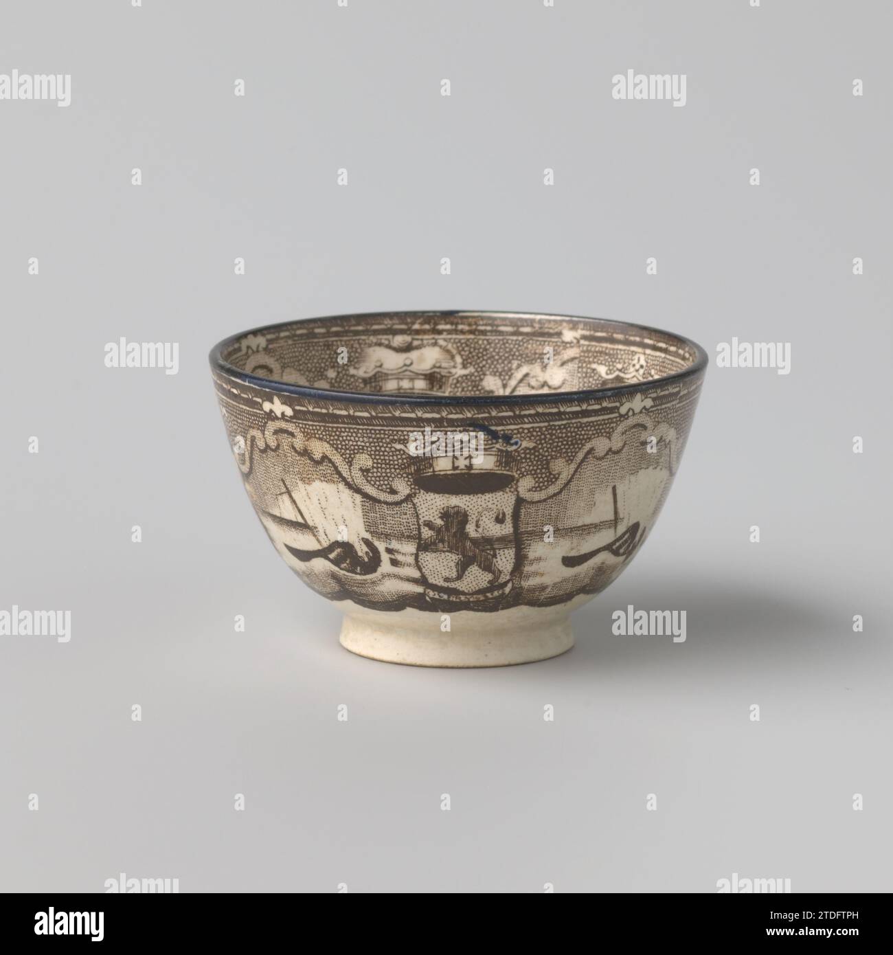 Head of hard baked pottery with a brown transfer as decoration ...
