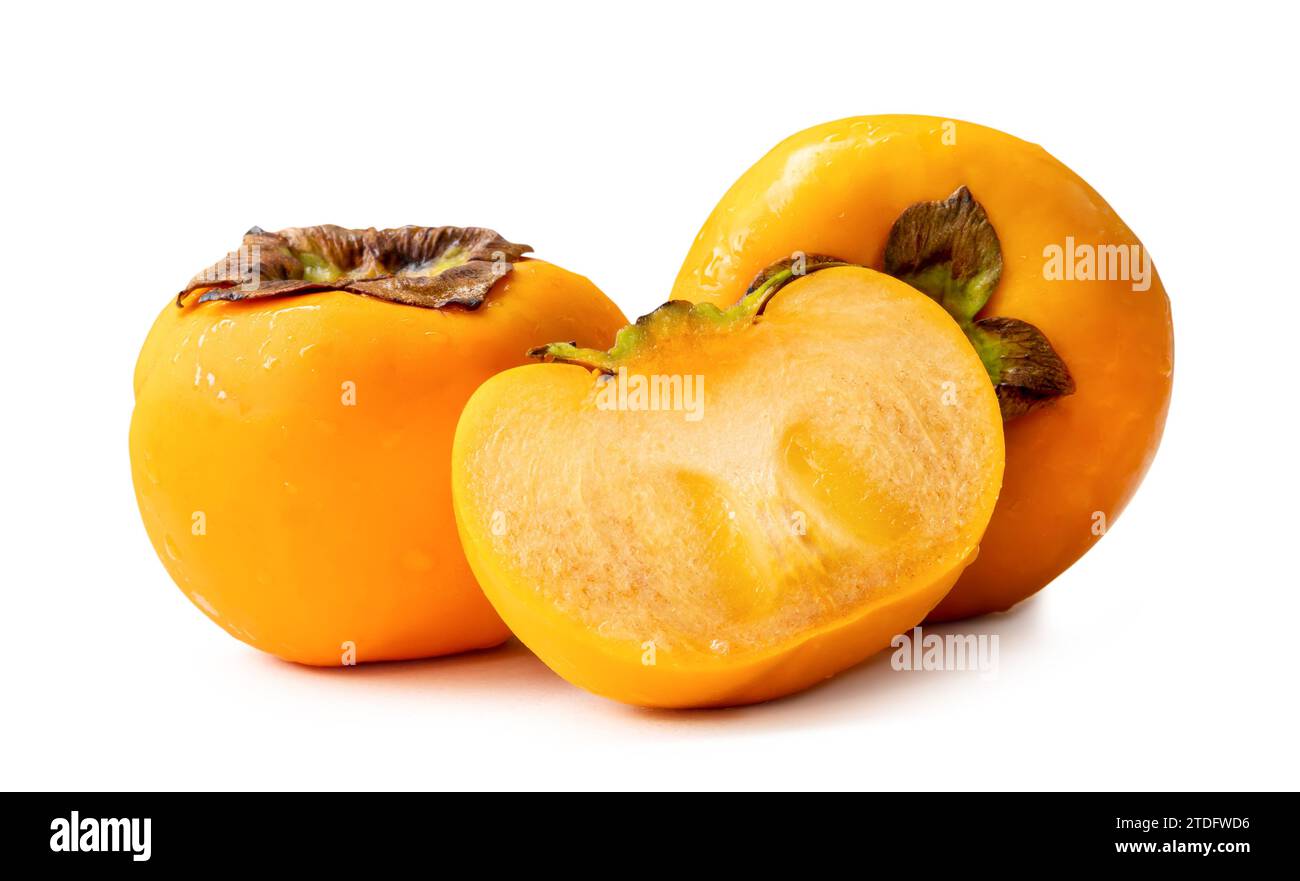 Orange ripe persimmons with half in stack are isolated on white ...
