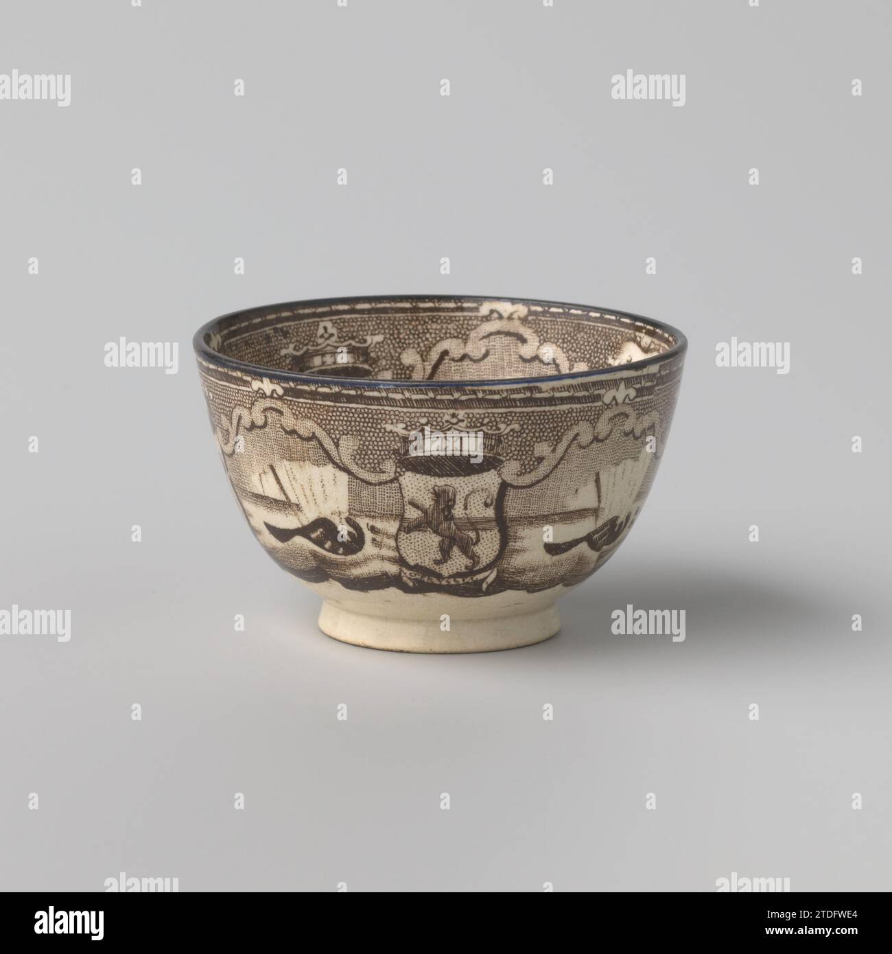Head of hard baked pottery with a brown transfer as decoration ...