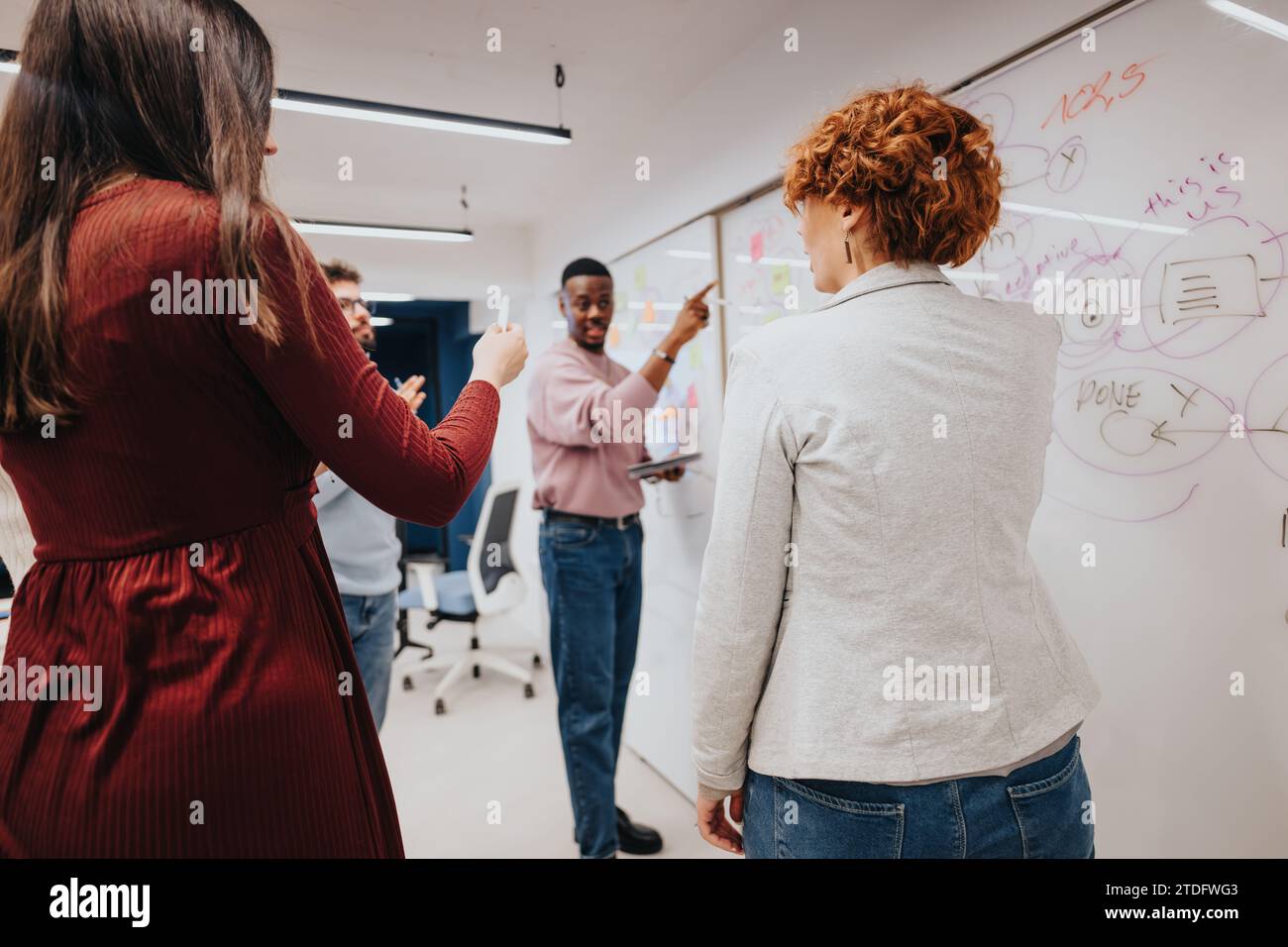 Collaborative business team working together on strategic planning and ...