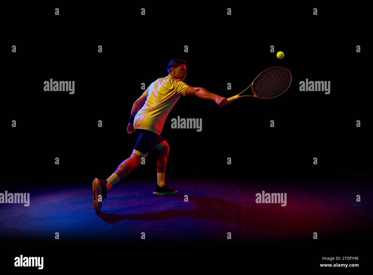 Concentrated and competitive man, tennis athlete during training ...