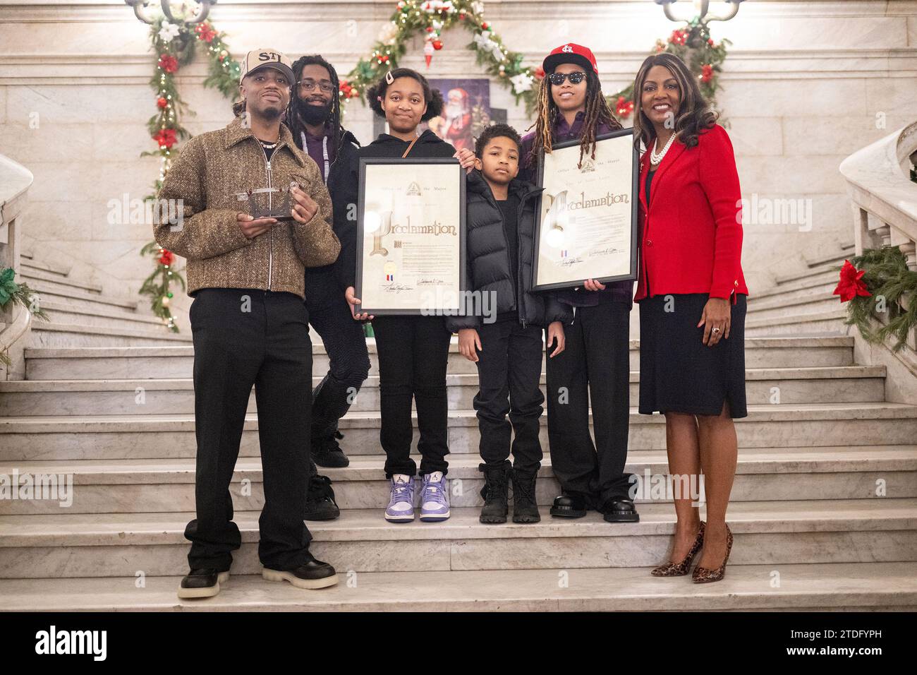 Metro Boomin, left, poses with family members and St. Louis City Mayor ...