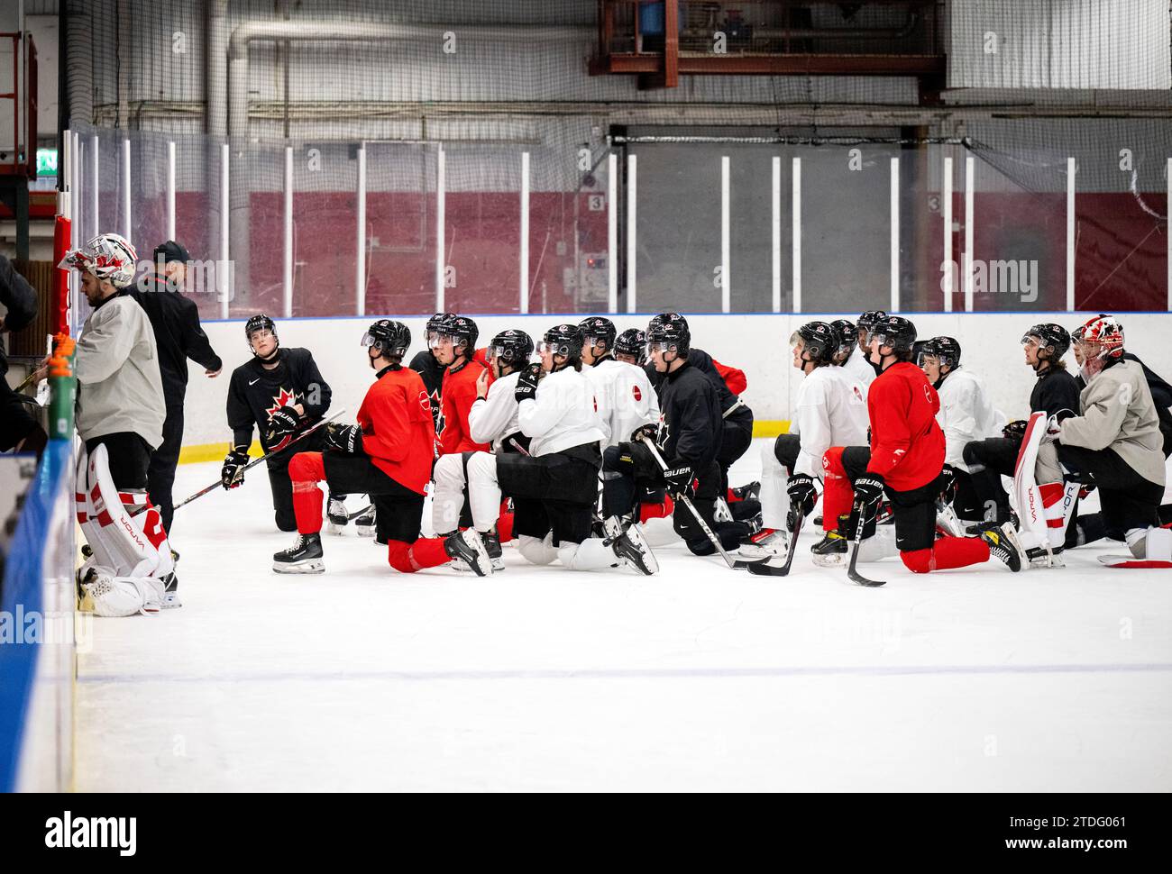 Alan Letang, the national team captain (right), gives instructions when ...