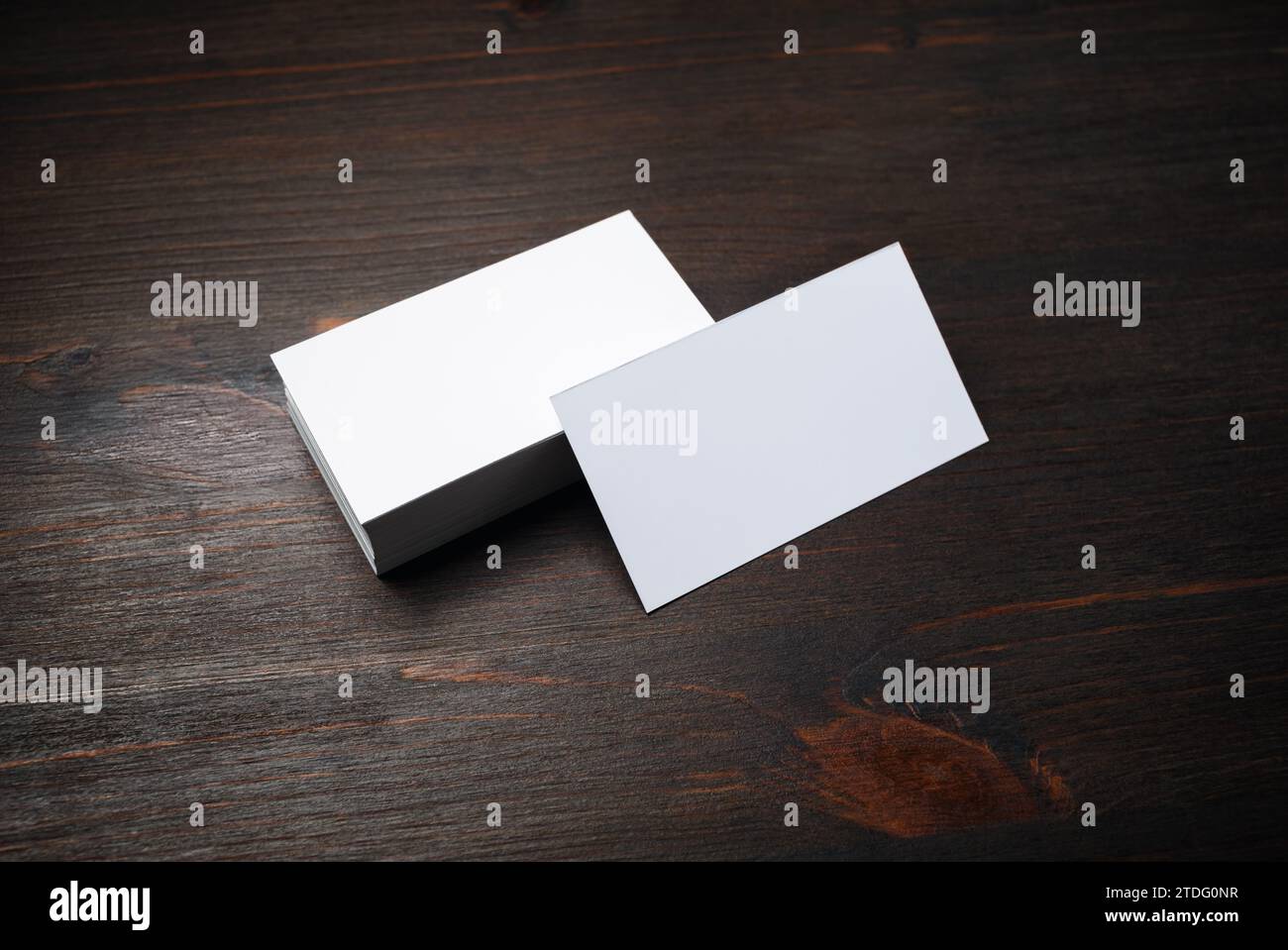 Blank white business cards on wooden background. Mockup for ID ...