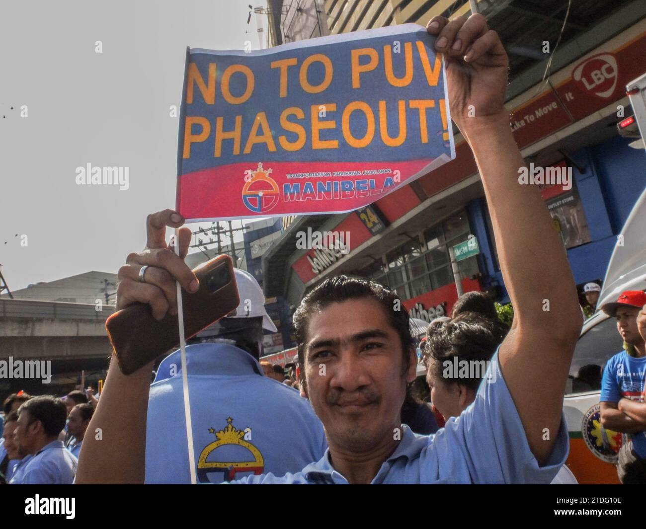 Caloocan City, Philippines. 18th Dec, 2023. A protester holds a banner ...