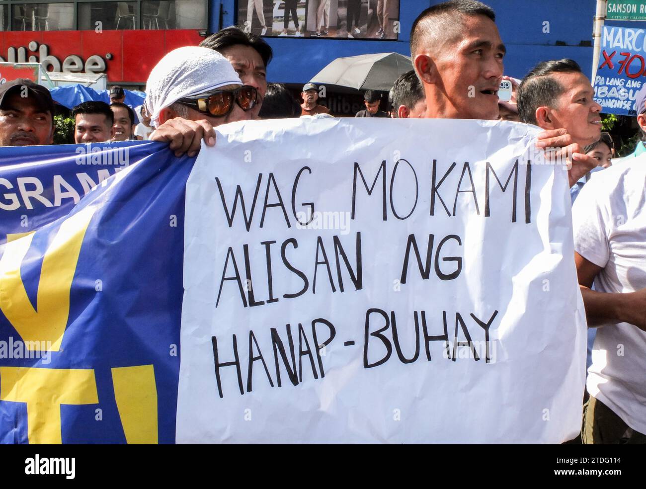 Caloocan City, Philippines. 18th Dec, 2023. Protesters hold a placard ...