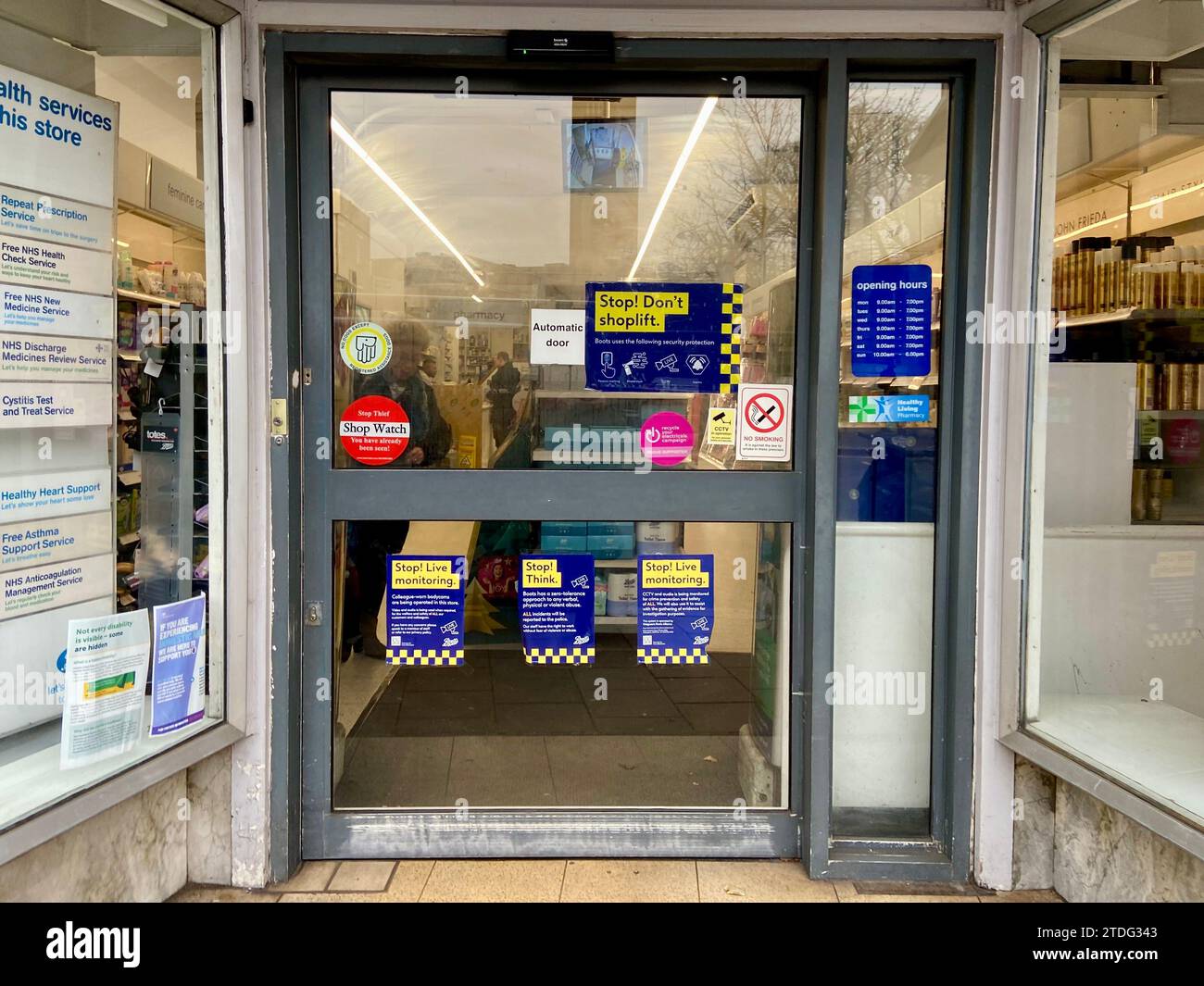 signs in boots the chemist shop window in crouch end haringey N8 north ...