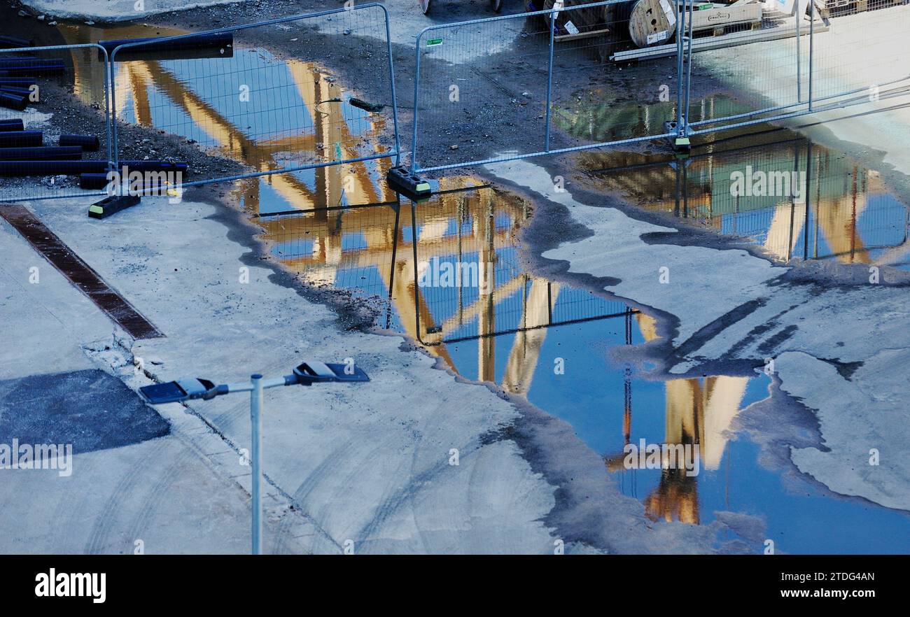 Timber frame building reflected in a large puddle Stock Photo - Alamy