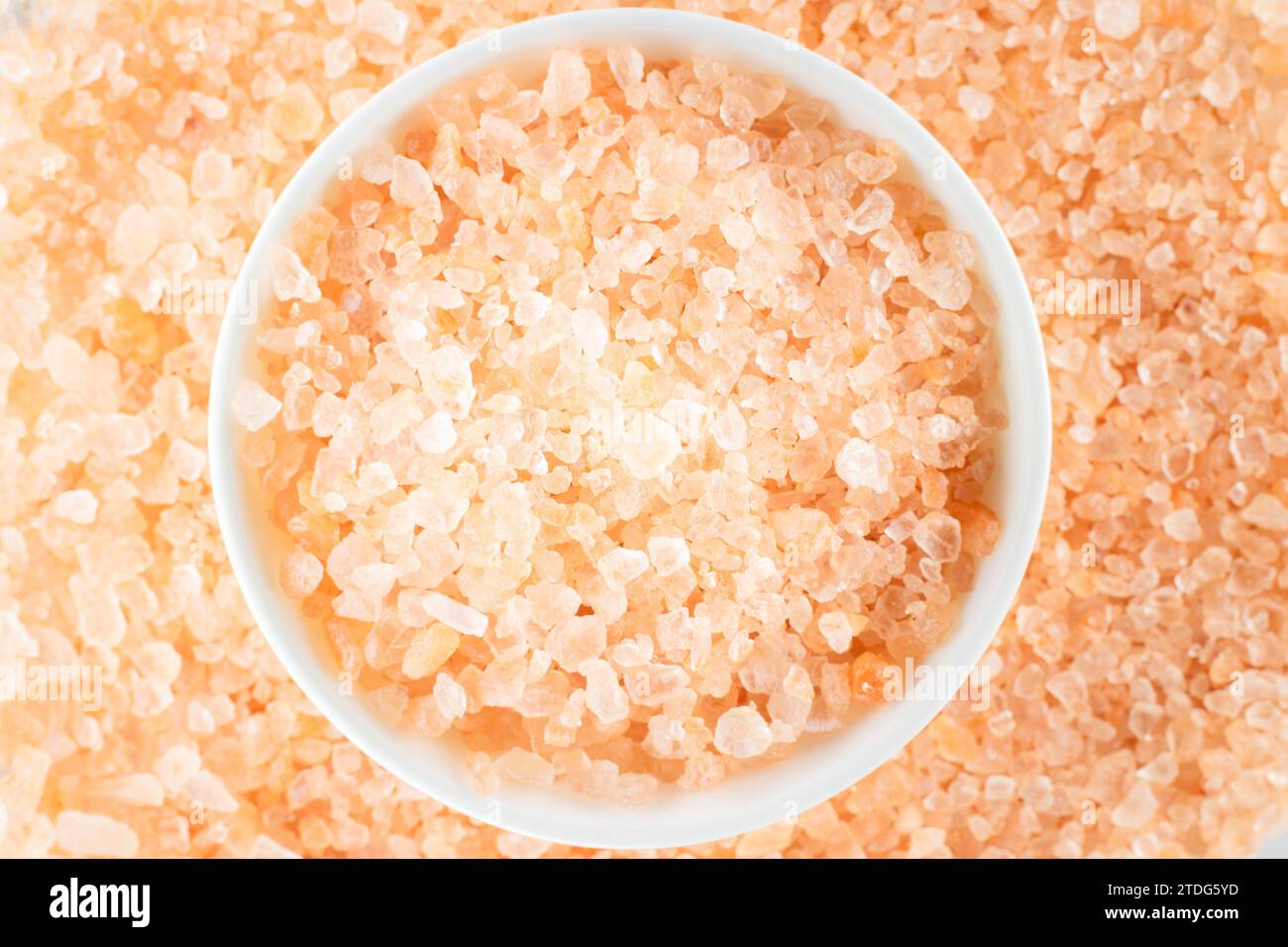 Himalayan Pink Salt in White bowl on Himalayan Pink Salt background.top ...