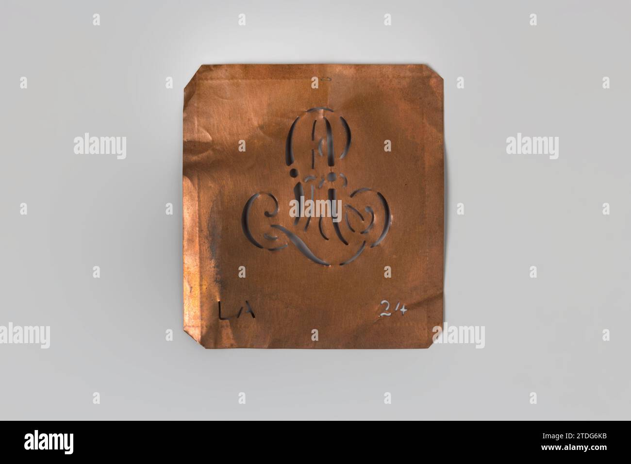 Red copper template, rectangular, with punched initials 'la', very fine ...