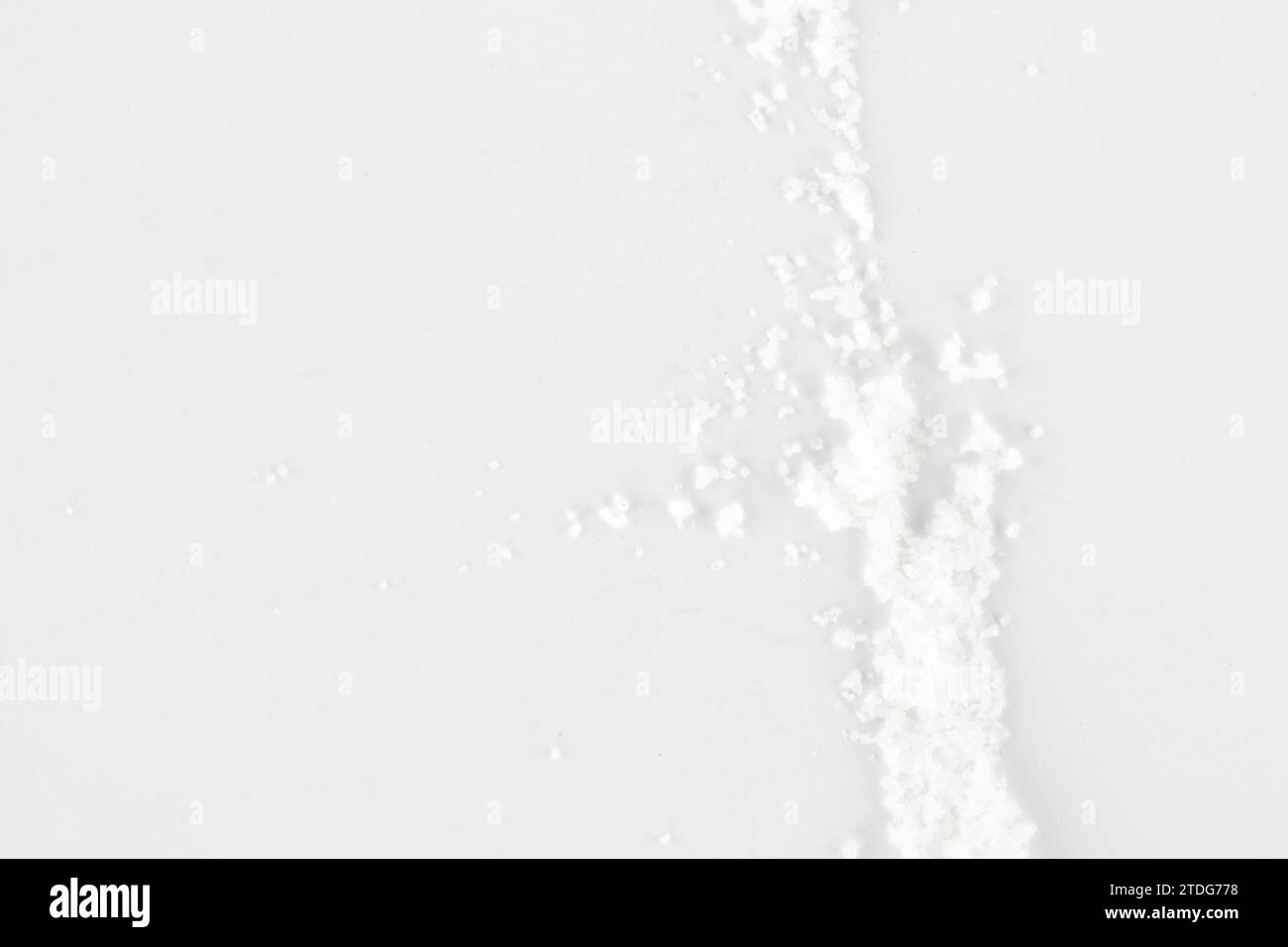White sea salt scattered isolated on white background. Top view Stock ...