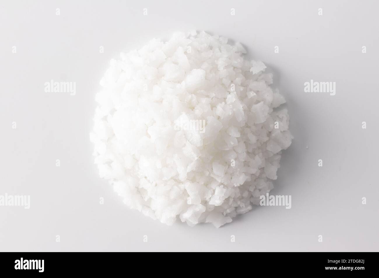 salt crystals piled up in circle shape isolated on white background ...