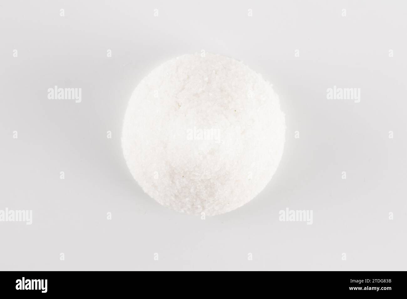table white salt piled in circle shape isolated on white background ...