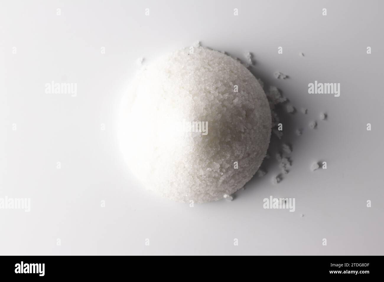 Finely ground table salt piled in circle shape isolated on white ...