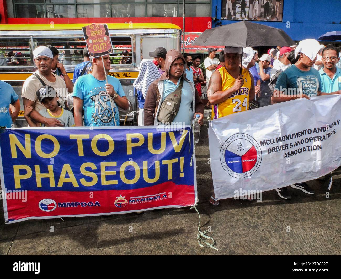 Caloocan City, Philippines. 18th Dec, 2023. Protesters hold banners and ...