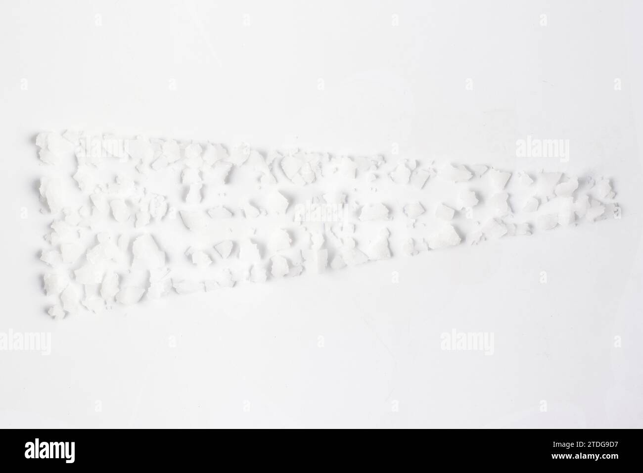 white sea salt placed in shapes on a white background Stock Photo - Alamy