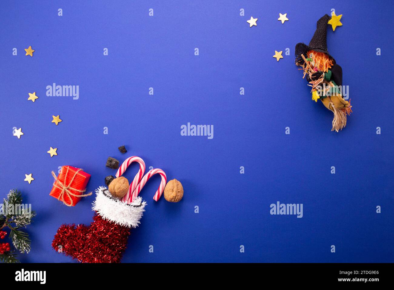 Epiphany day tradition. Befana and red stocking with sweet coal and ...