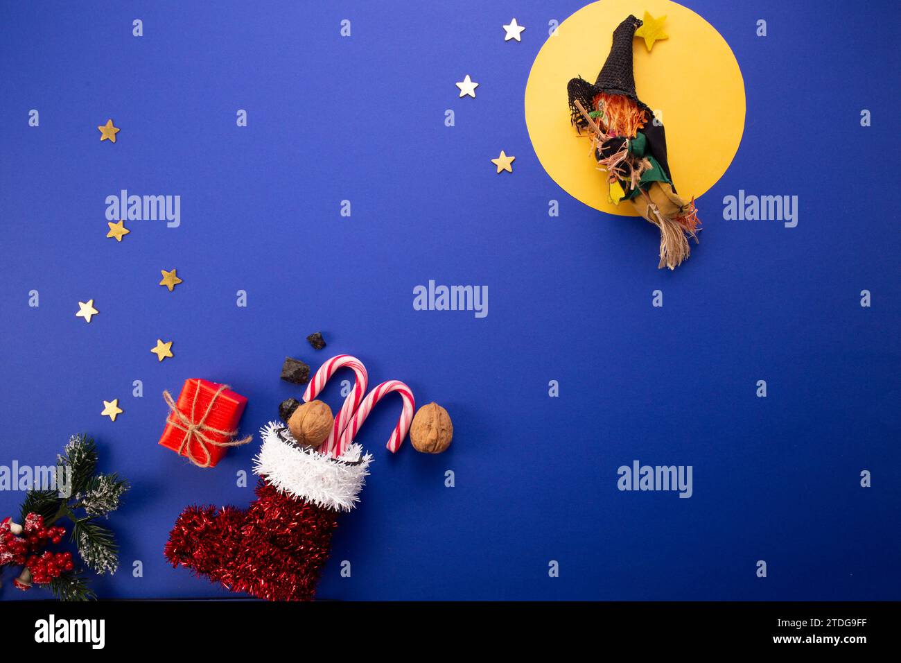 Epiphany day tradition. Befana and red stocking with sweet coal and ...