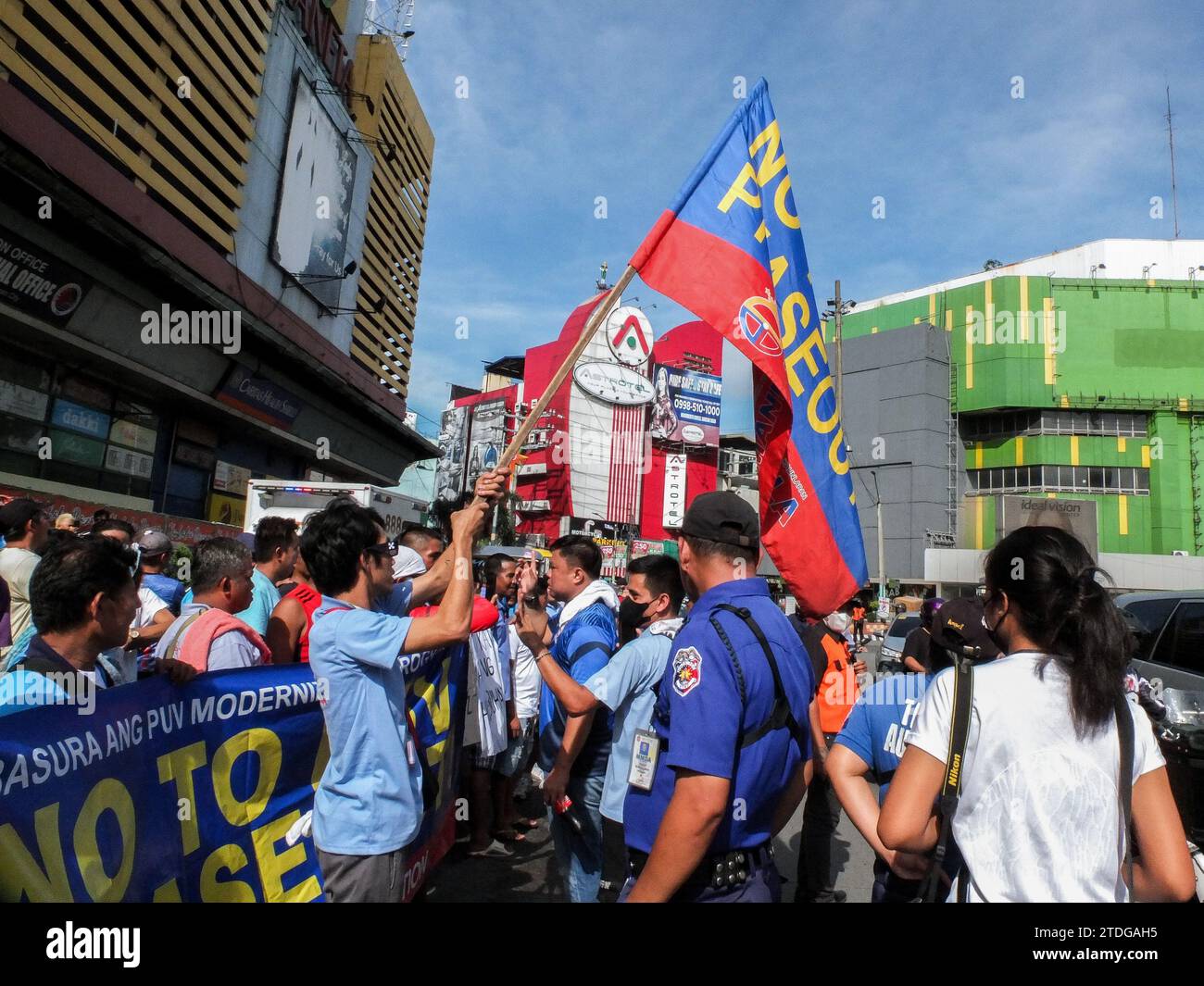 Caloocan City, Philippines. 18th Dec, 2023. A protester waves his flag ...
