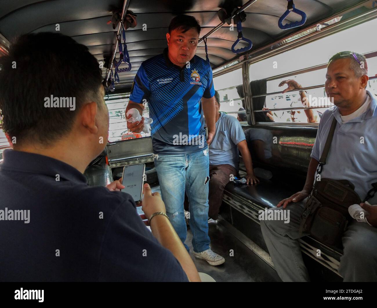 Manibela President, Mar Valbuena is interviewed by a news reporter ...