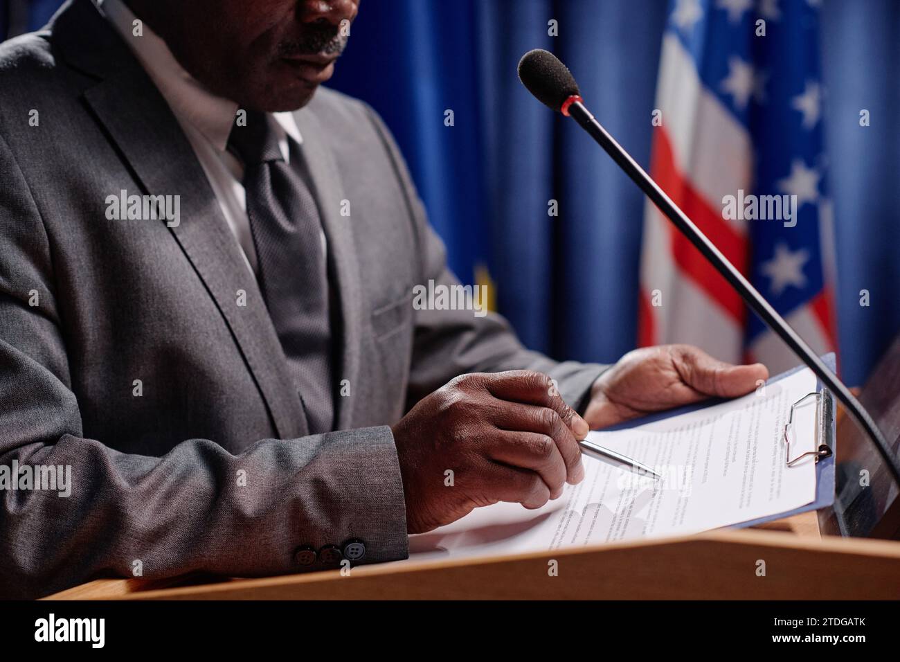 African man reading into microphone hi-res stock photography and images ...