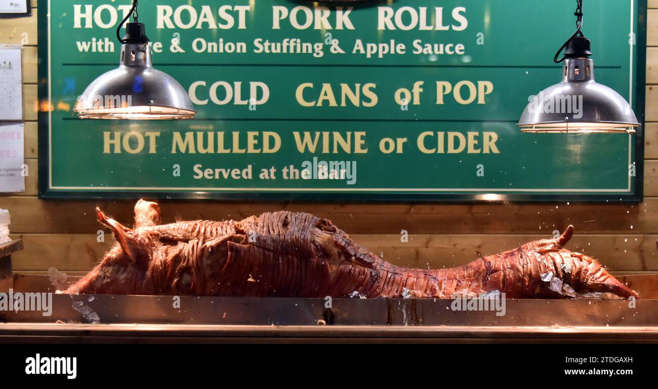 Stall features a roasted pig to provide pork for hot rolls. Christmas ...