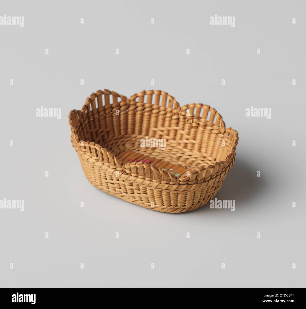 Basket, oval, with braided diamond pattern and embroidered flowers in ...