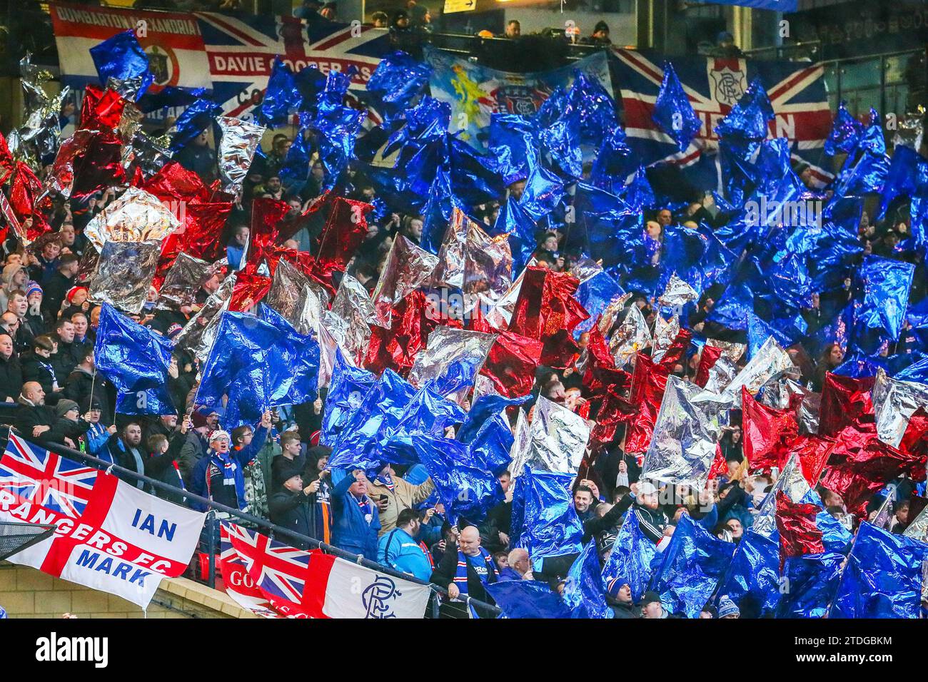 Rangers Football Club supporters waving red, white and blue foil flags ...