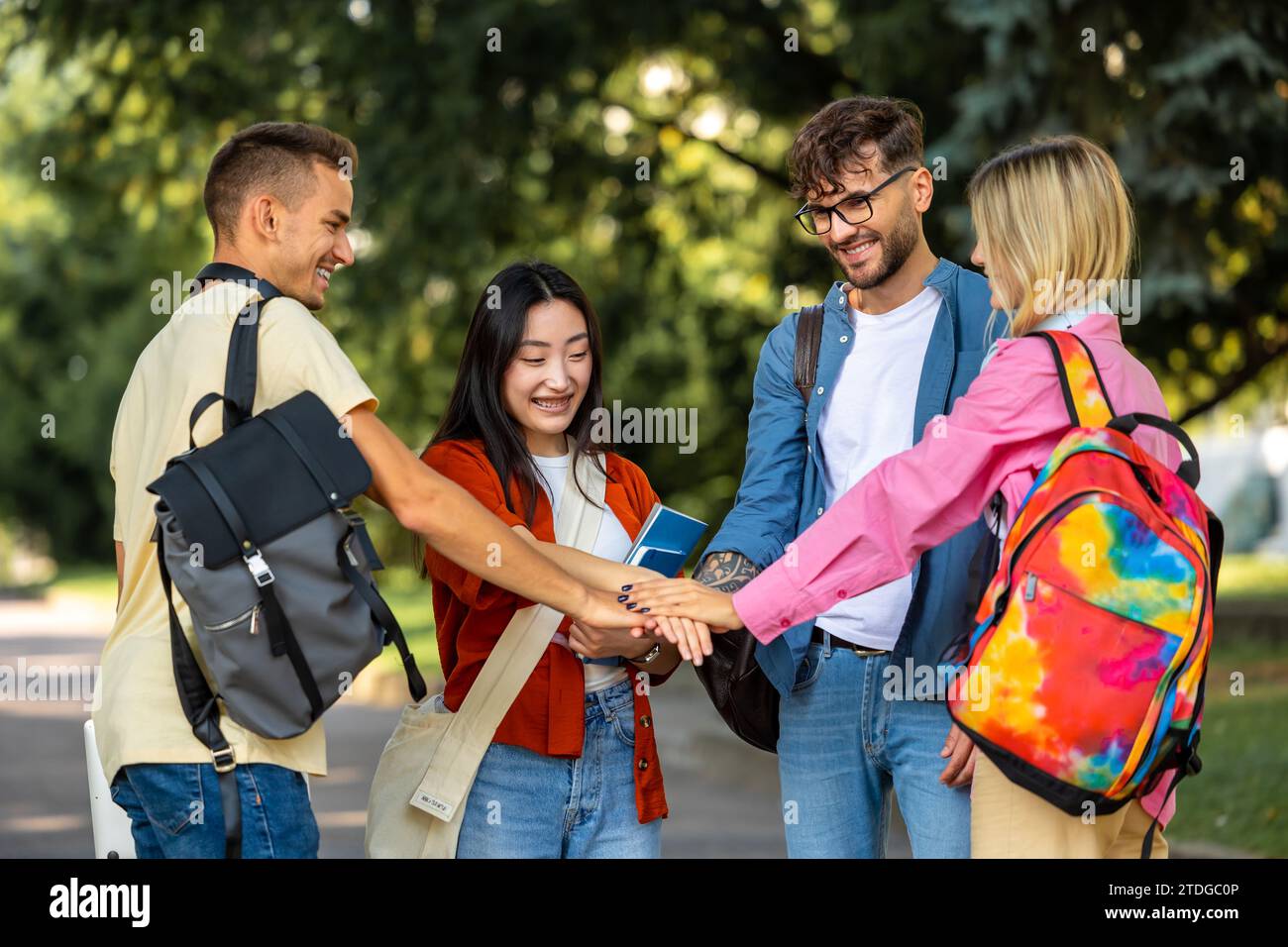 Group of young people having a walk in the park Stock Photo - Alamy