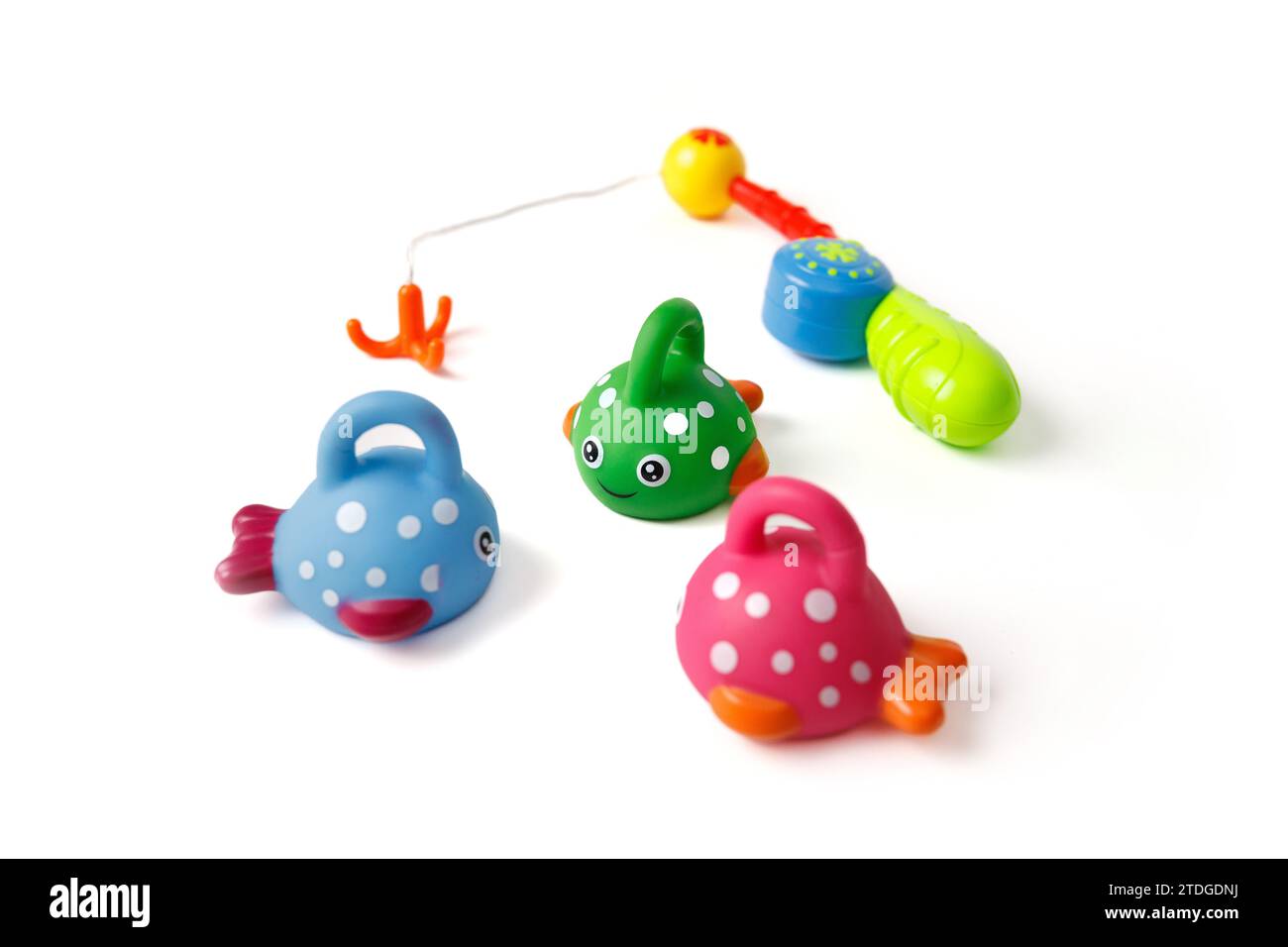 Children's set of fishing toys with cute fish and fishing rod on a ...