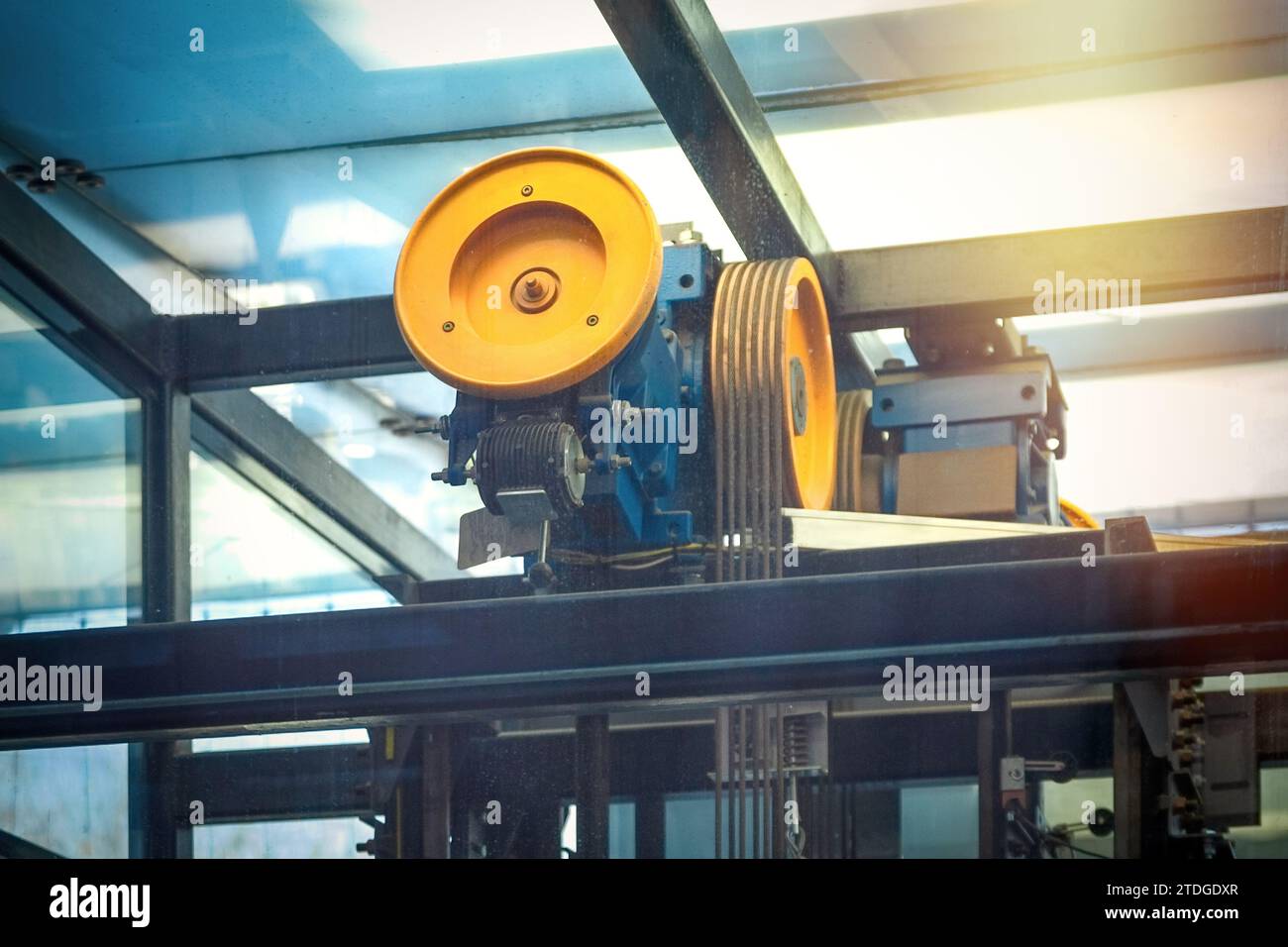 Elevator motor with pulleys and steel cables. lift engine Stock Photo ...