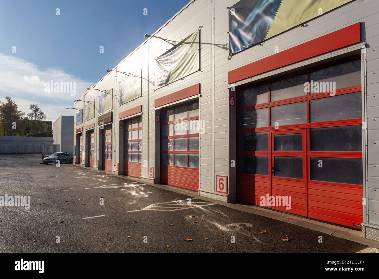 Building with a commercial vehicle repair shop with six garage doors ...