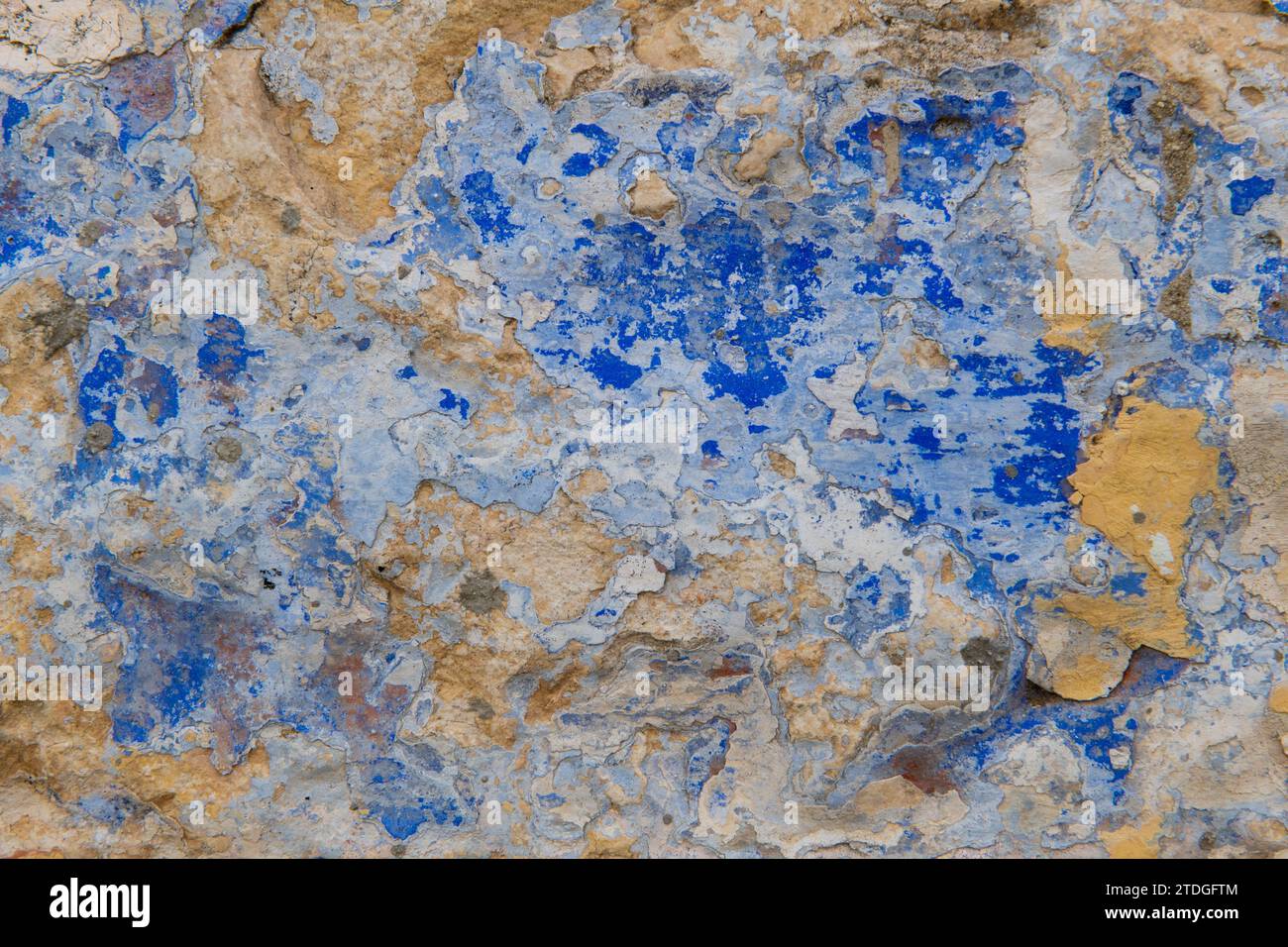 Abstract, detail, pattern of a section of multi-colored, peeling blue ...