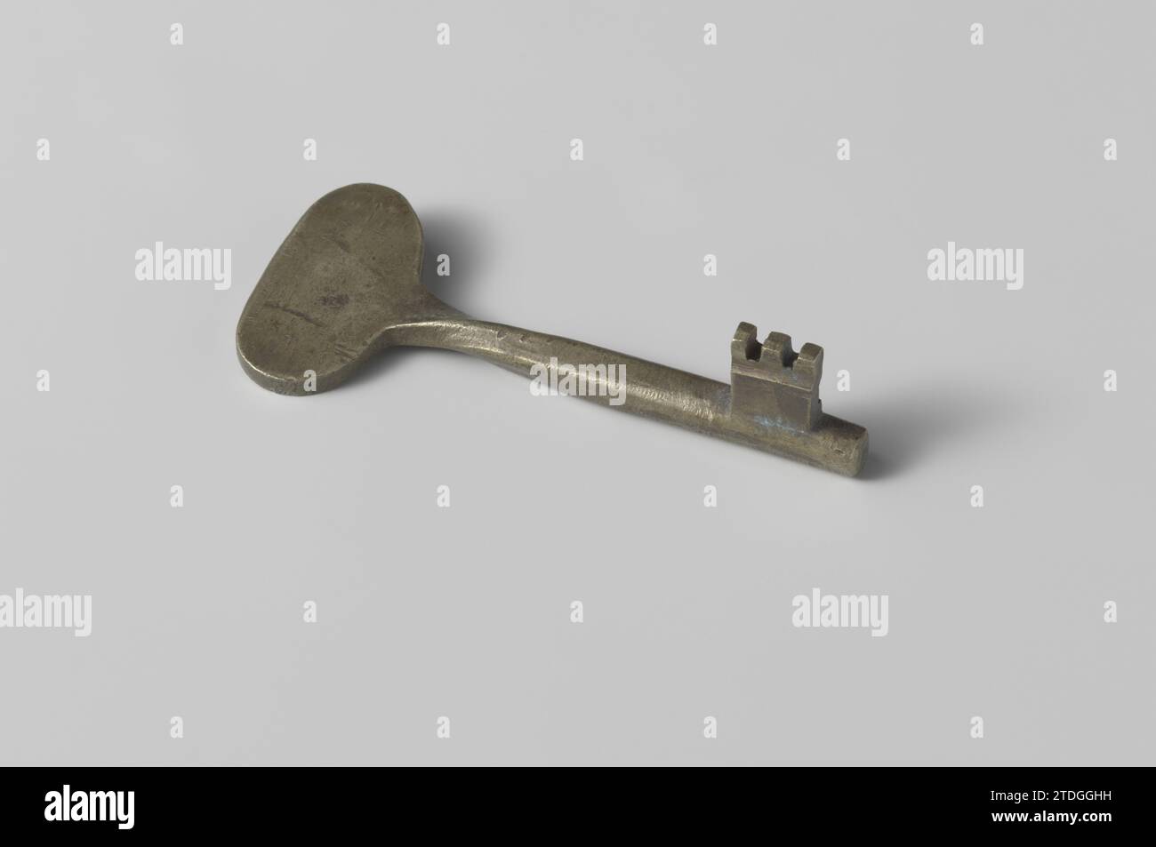 Key, c. 1900 Key with solid, oval handle perpendicular placed on the ...