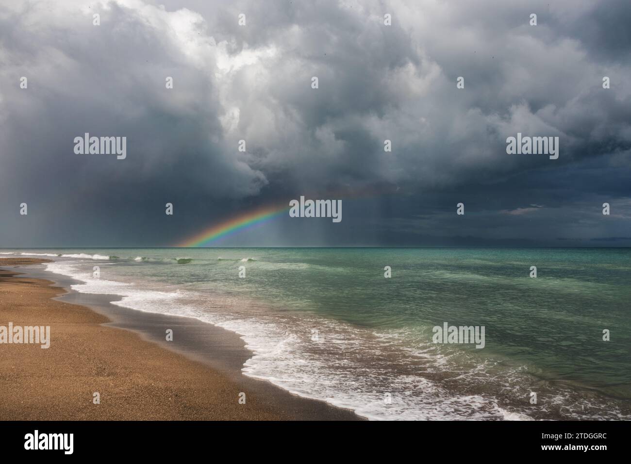 A rainbow is disappearing in the midst of stormy clouds Stock Photo - Alamy