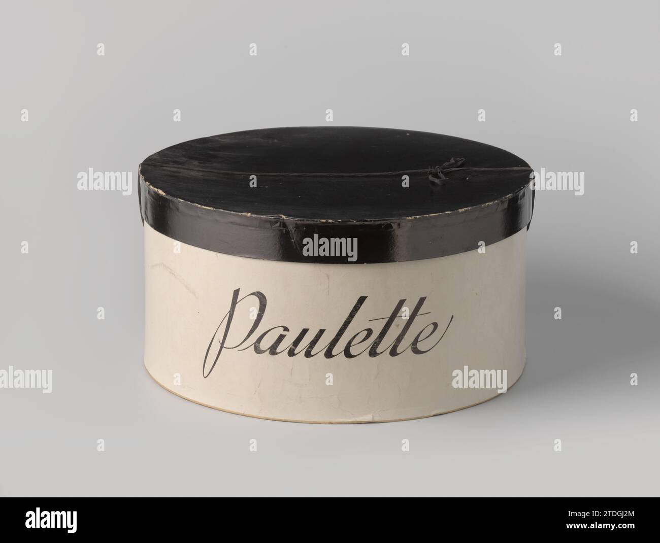 Oval hat box of cardboard covered with white paper; The loose lid is ...