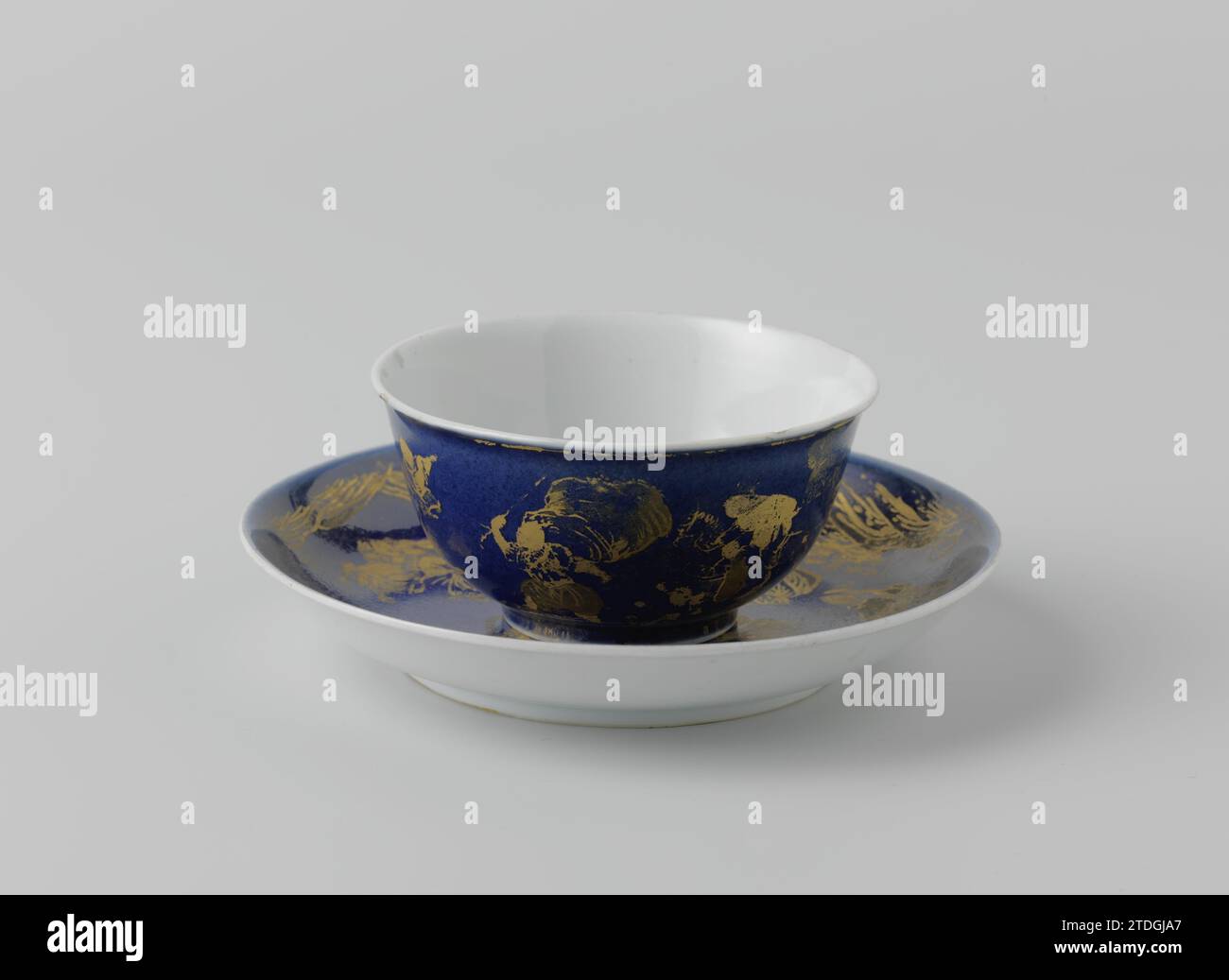 Bell-shaped cup and saucer with powder blue, figures, rocks and trees ...