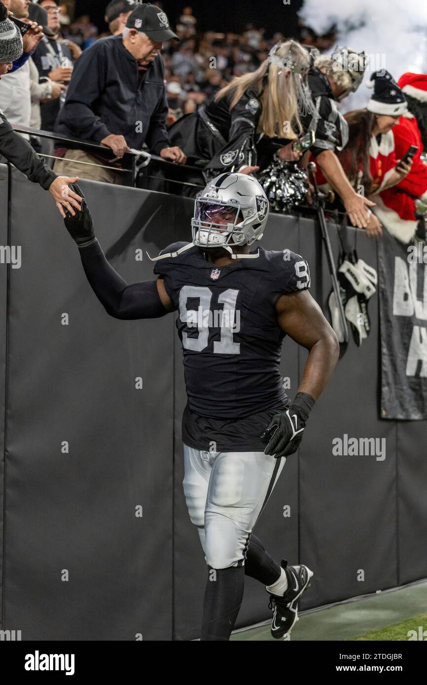 Las Vegas Raiders defensive tackle Bilal Nichols (91) enters the field ...