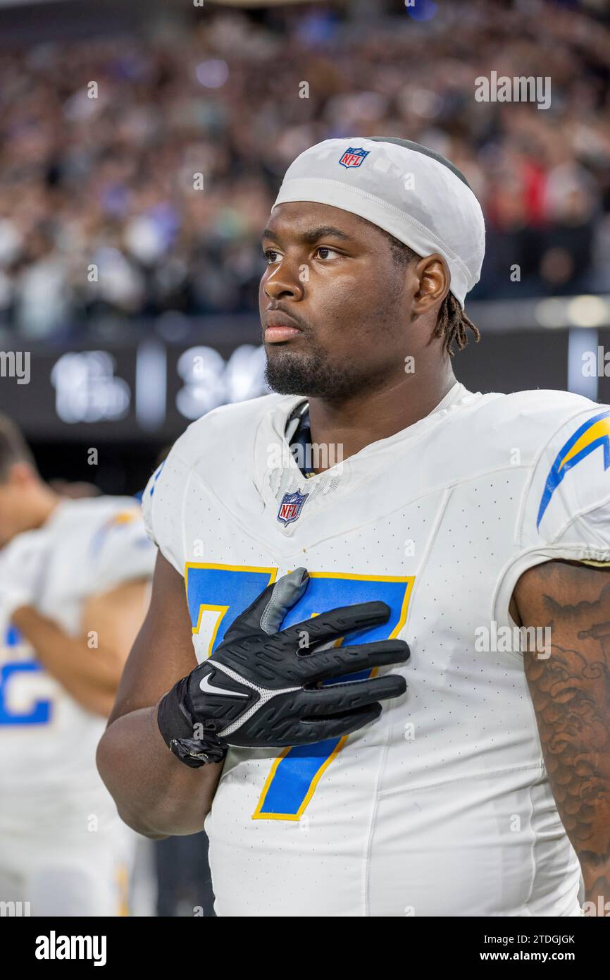 Los Angeles Chargers guard Zion Johnson (77) stands for the National ...