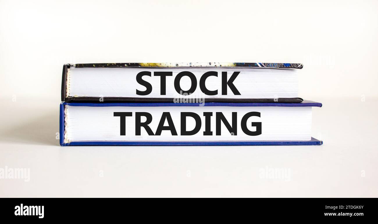 Stock trading symbol. Concept words Stock trading on beautiful books ...
