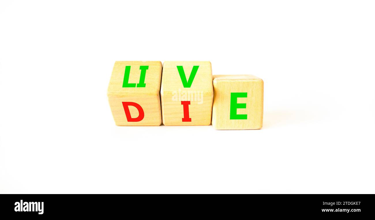 Live or die symbol. Concept word Live or Die on wooden cubes. Beautiful ...