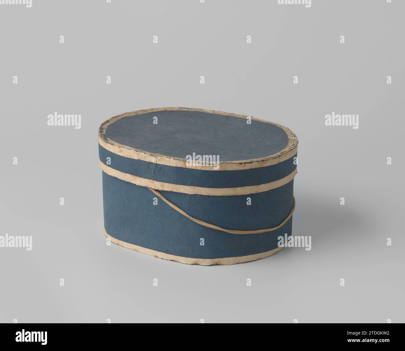 Oval hat box of cardboard, covered with dark blue paper with white ...